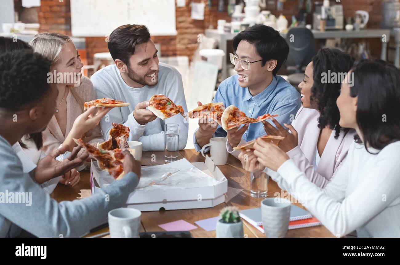 Multiracial work team pizza hi-res stock photography and images - Alamy