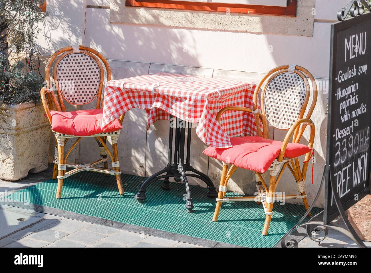 14 MAY 2018, BUDAPEST, HUNGARY: Table of traditional outdoor cafe with ...