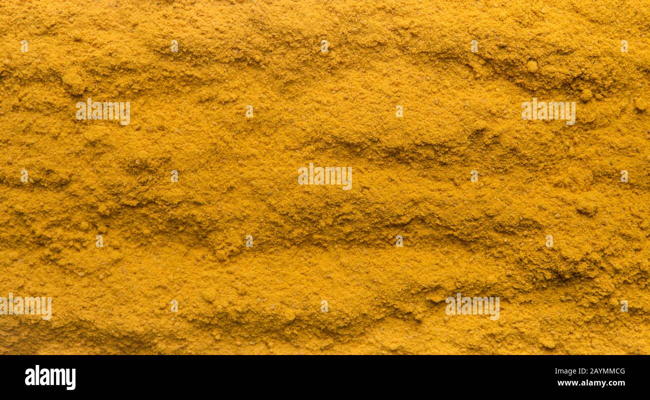 Turmeric powder texture background, copy space for text Stock Photo - Alamy