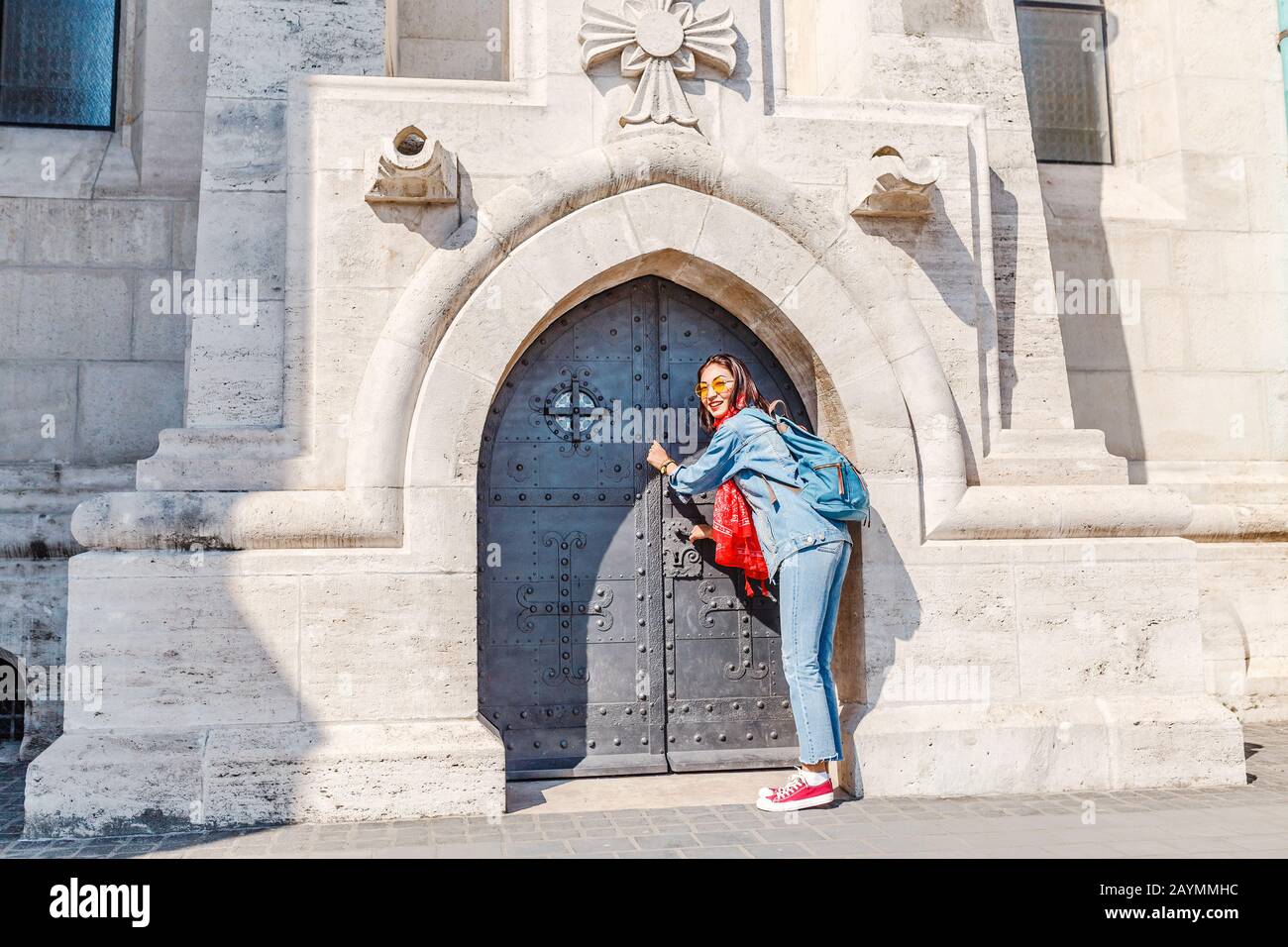 The tourist woman at gate of the old castle Stock Photo - Alamy