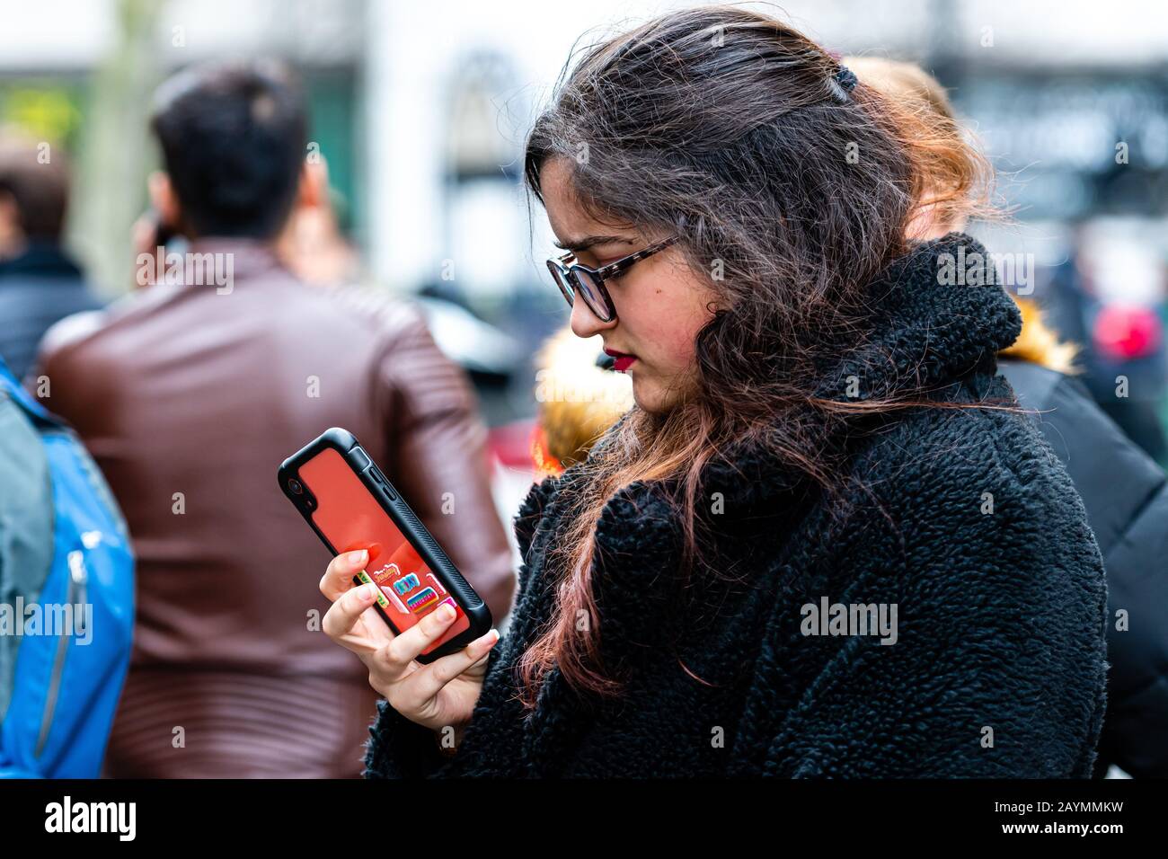 London, England, UK - January 2, 2020: Young woman with glasses ...