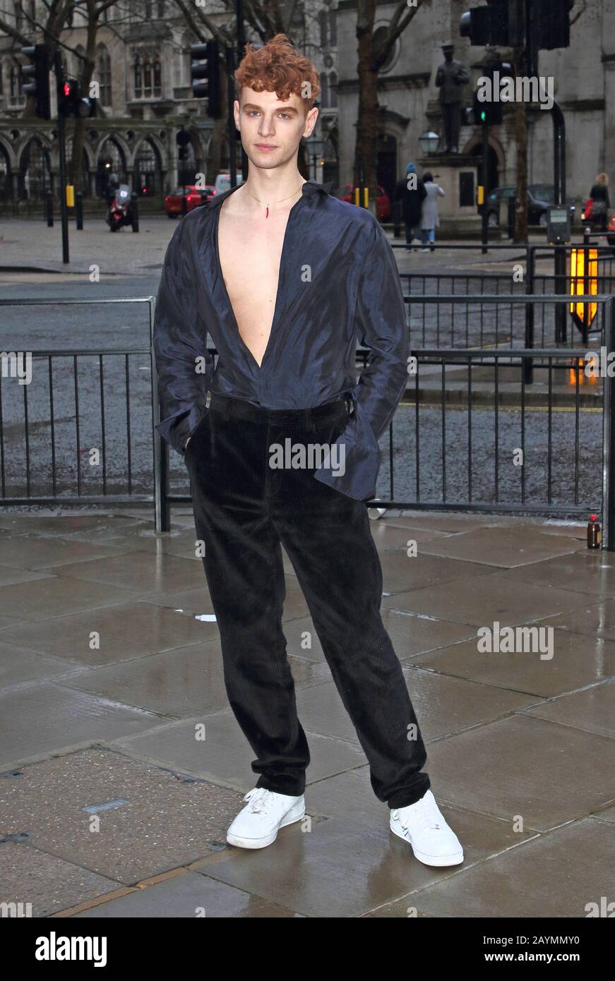 A man with unbuttoned Shirt poses for a photo outside the BFC Showspace ...