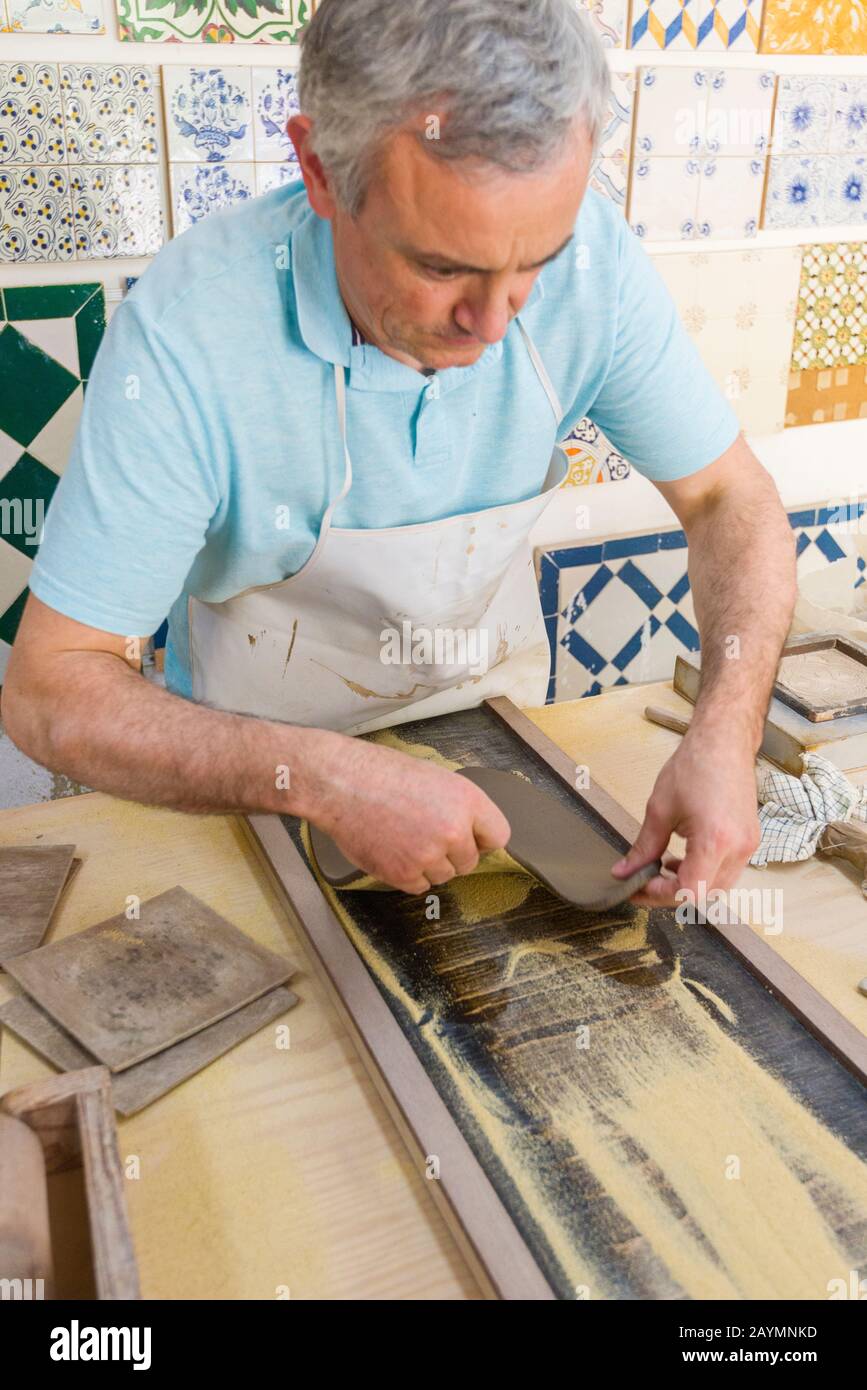the workshop of Azulejos de Azeitao. reproduces old azulejos on hand ...
