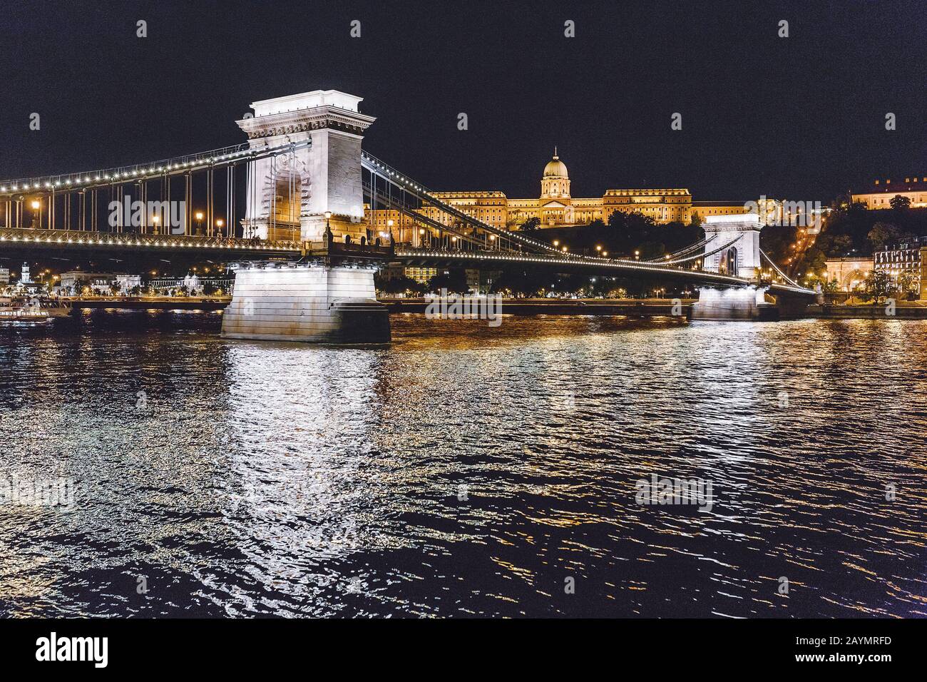 Night view of the Szechenyi Chain Bridge that spans the Danube between ...