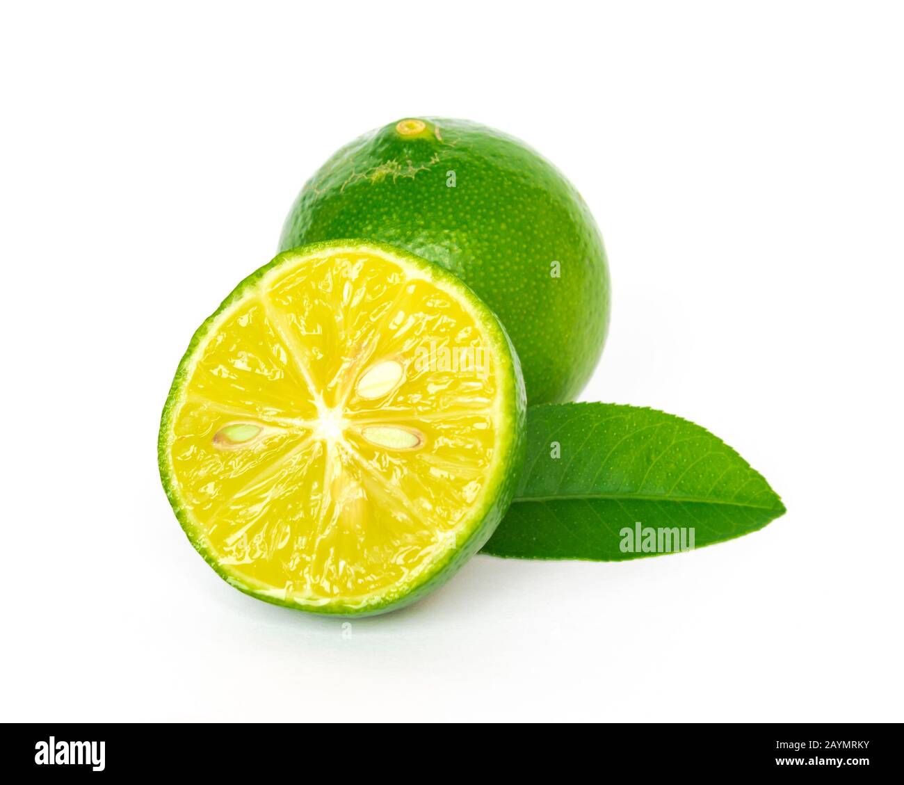 Studio shot single whole lime with slice cutout and leaves isolated on ...