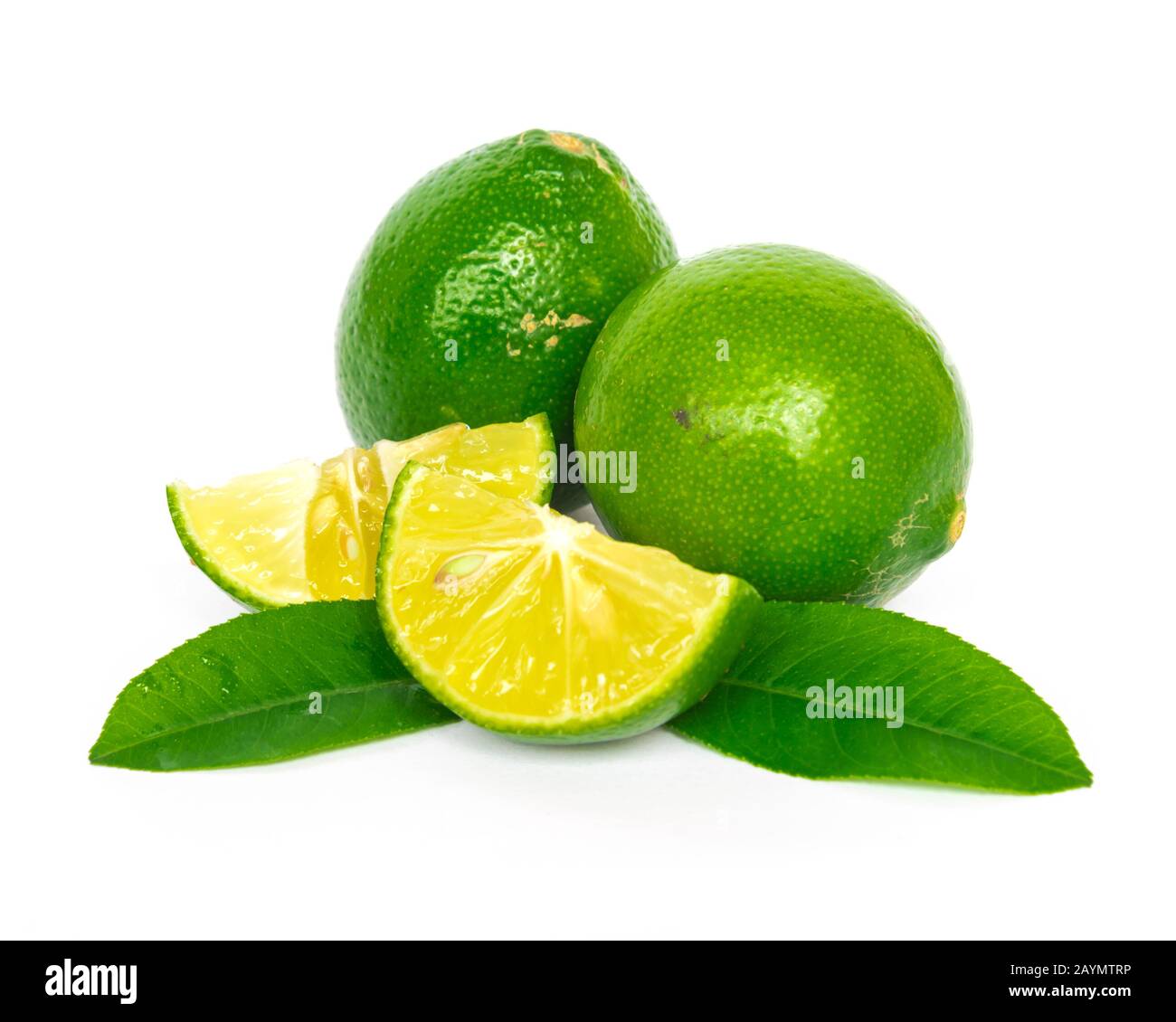 Pile of homegrown Asian limes with half cuts slices and green leaves ...