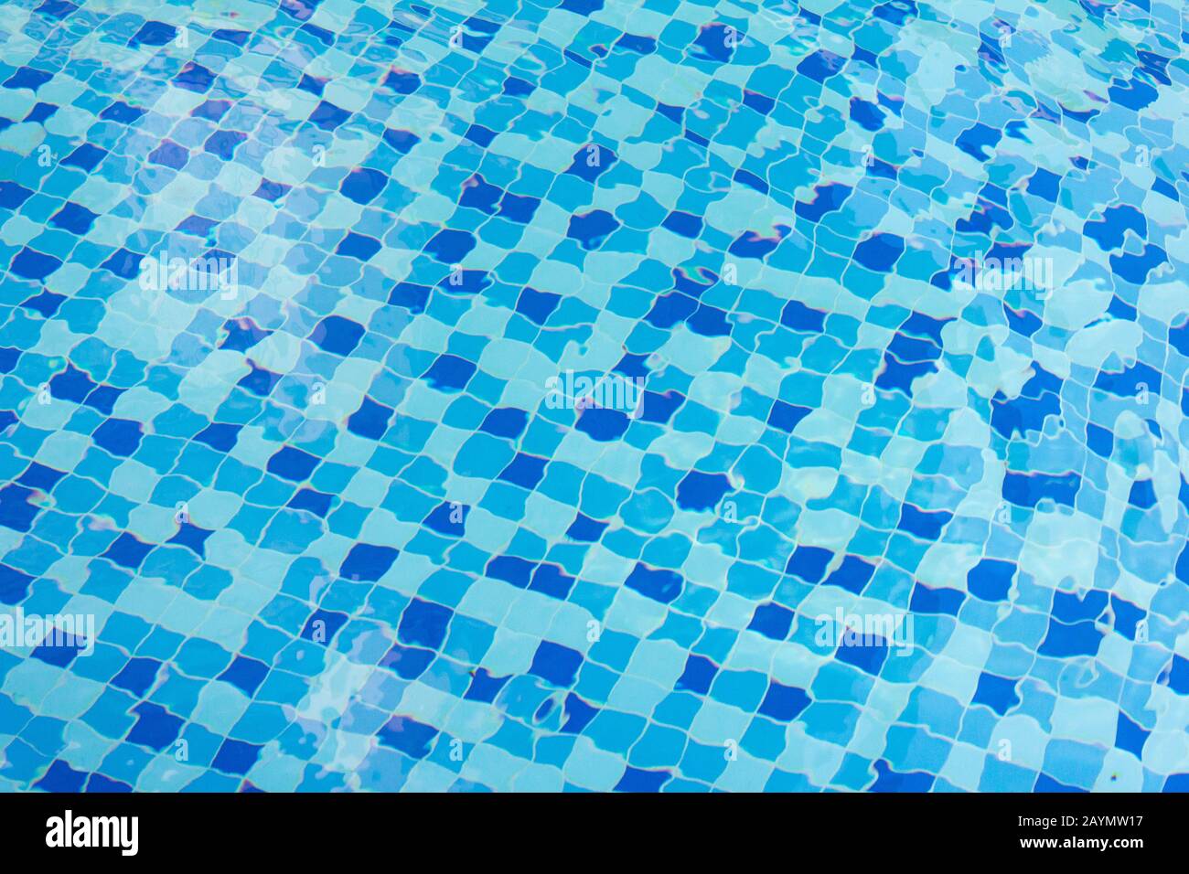 Ripple Water in swimming pool with blue tile floor background Stock ...
