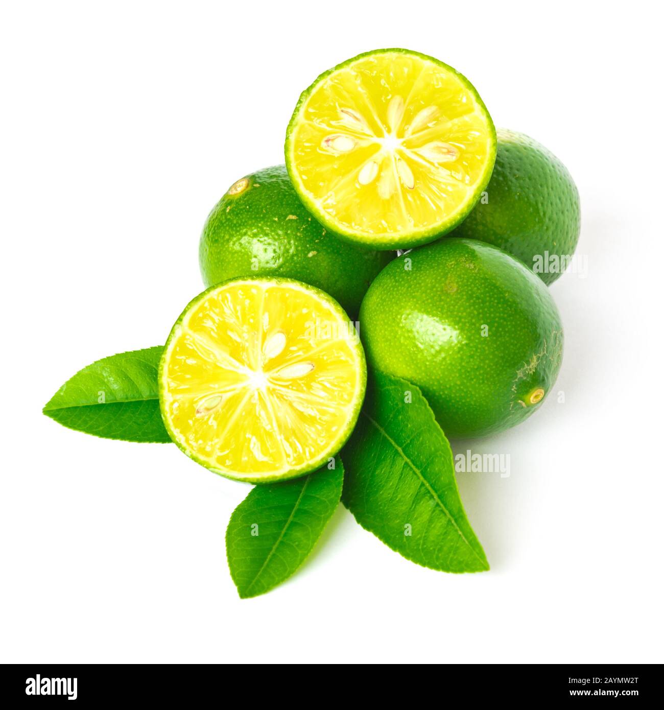 Pile of homegrown Asian limes with half cuts slices and green leaves ...