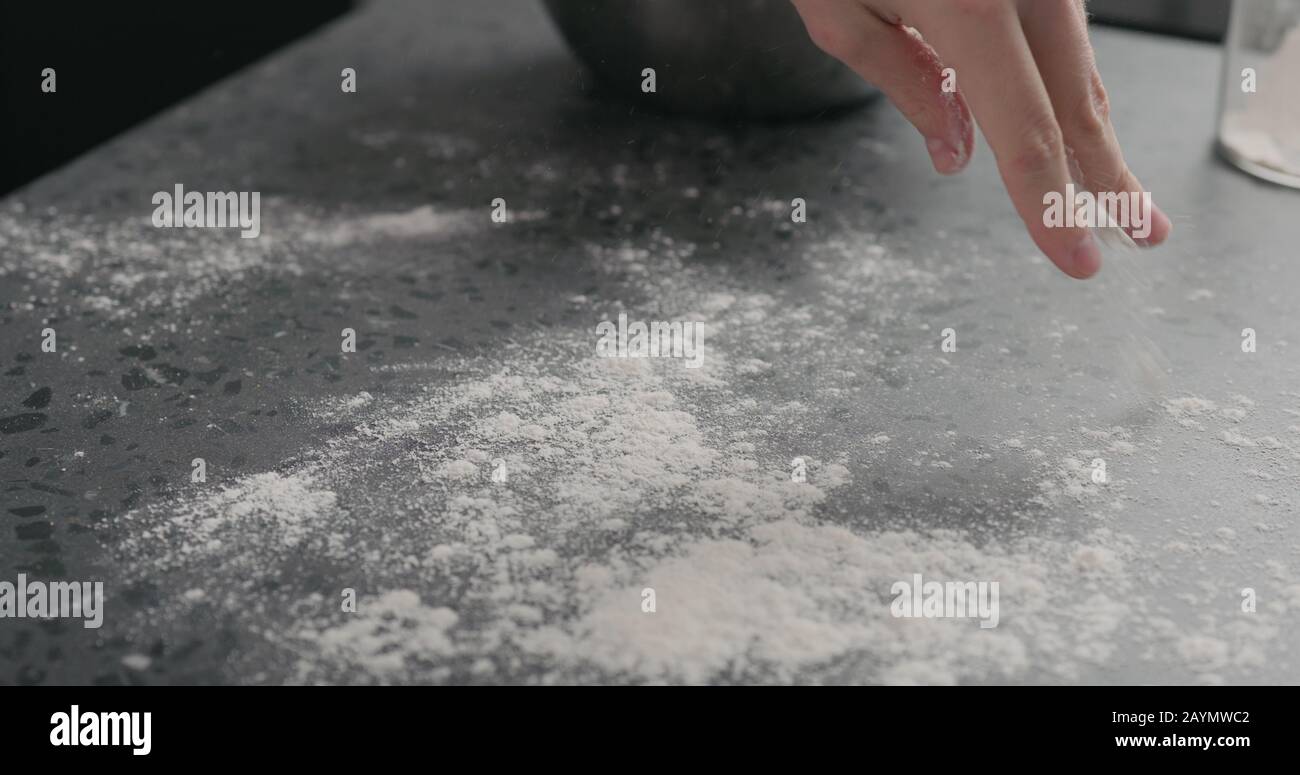 Baker sprinkles on dough hi-res stock photography and images - Alamy