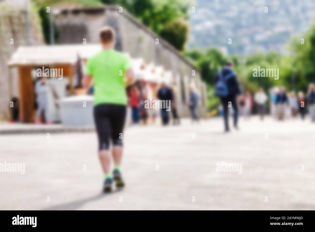 Blur image of a running man , sport in city background Stock Photo - Alamy