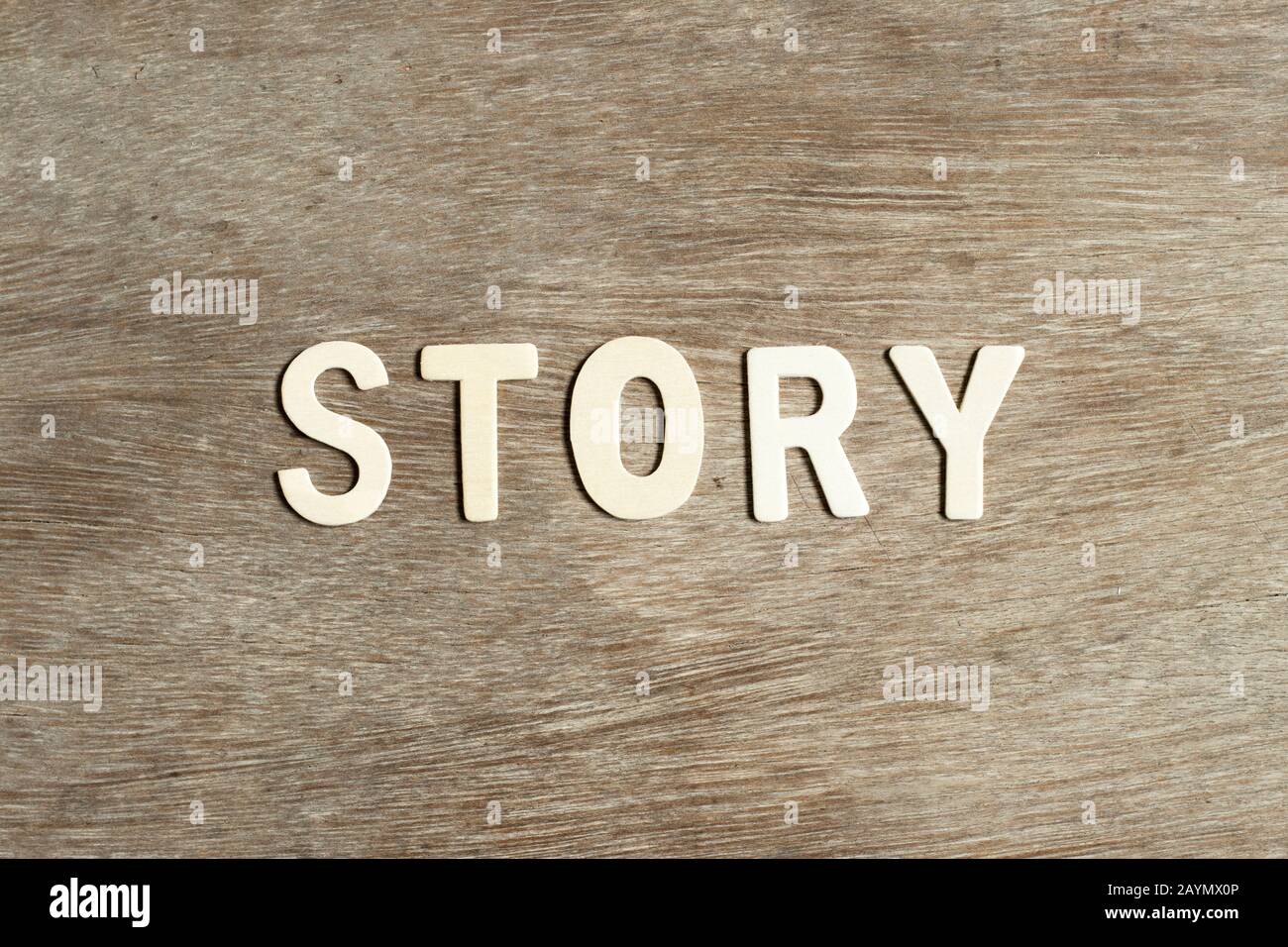 Alphabet letter in word story on wood background Stock Photo - Alamy