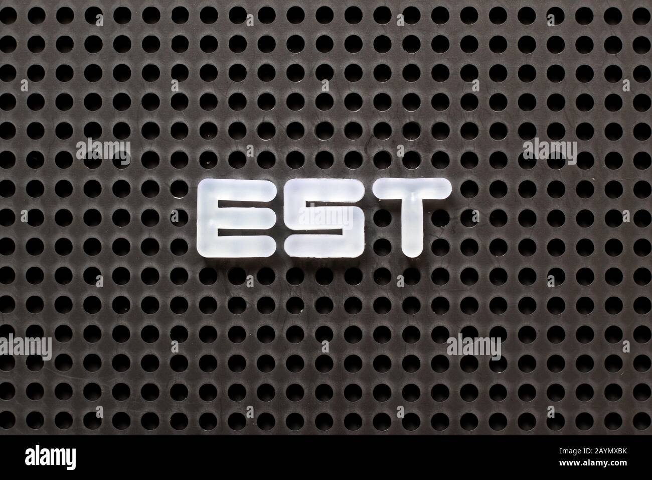 Black color pegboard with white letter in word est Stock Photo - Alamy