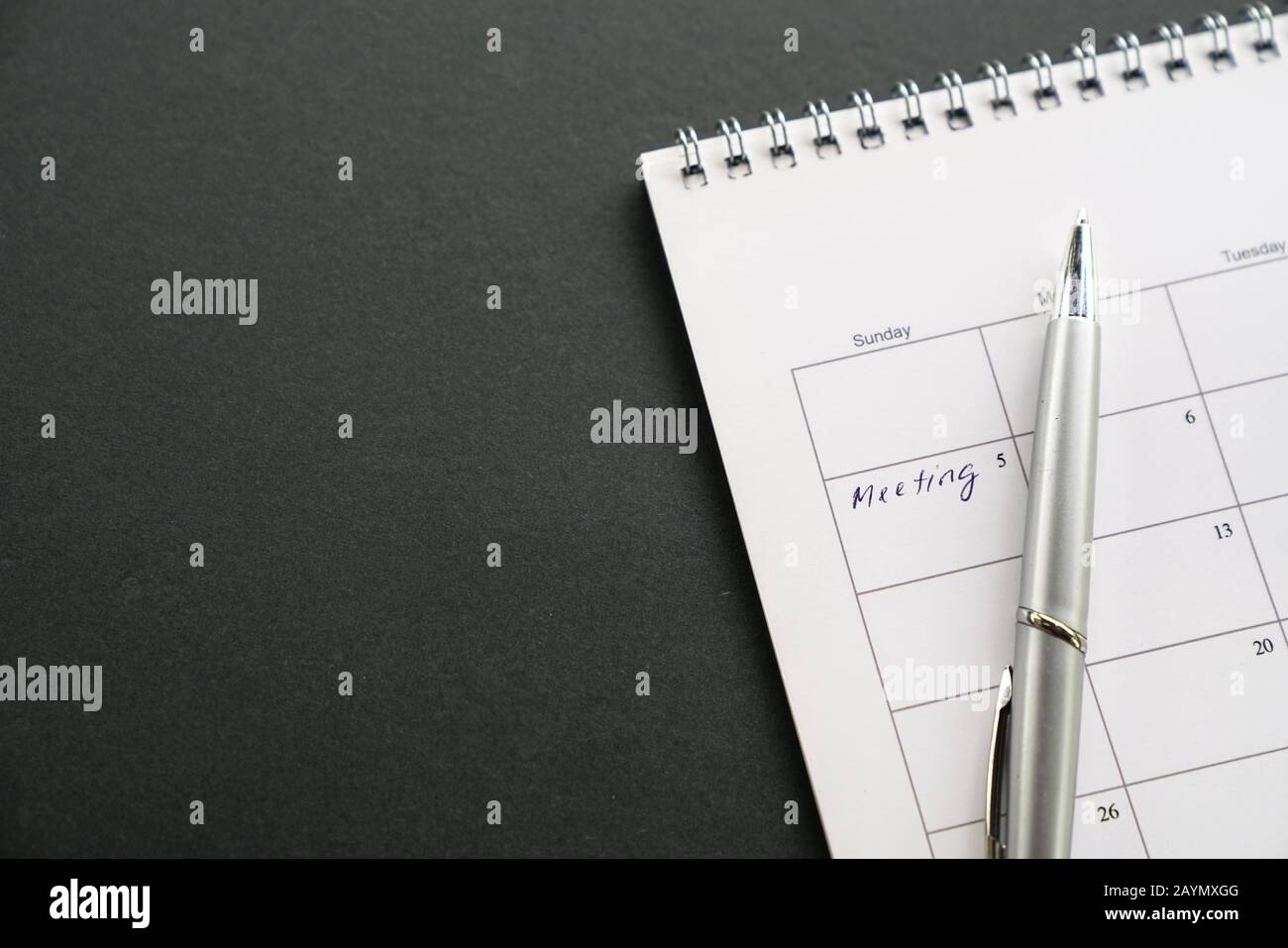 White clean calendar on black background with copy space. Words ...