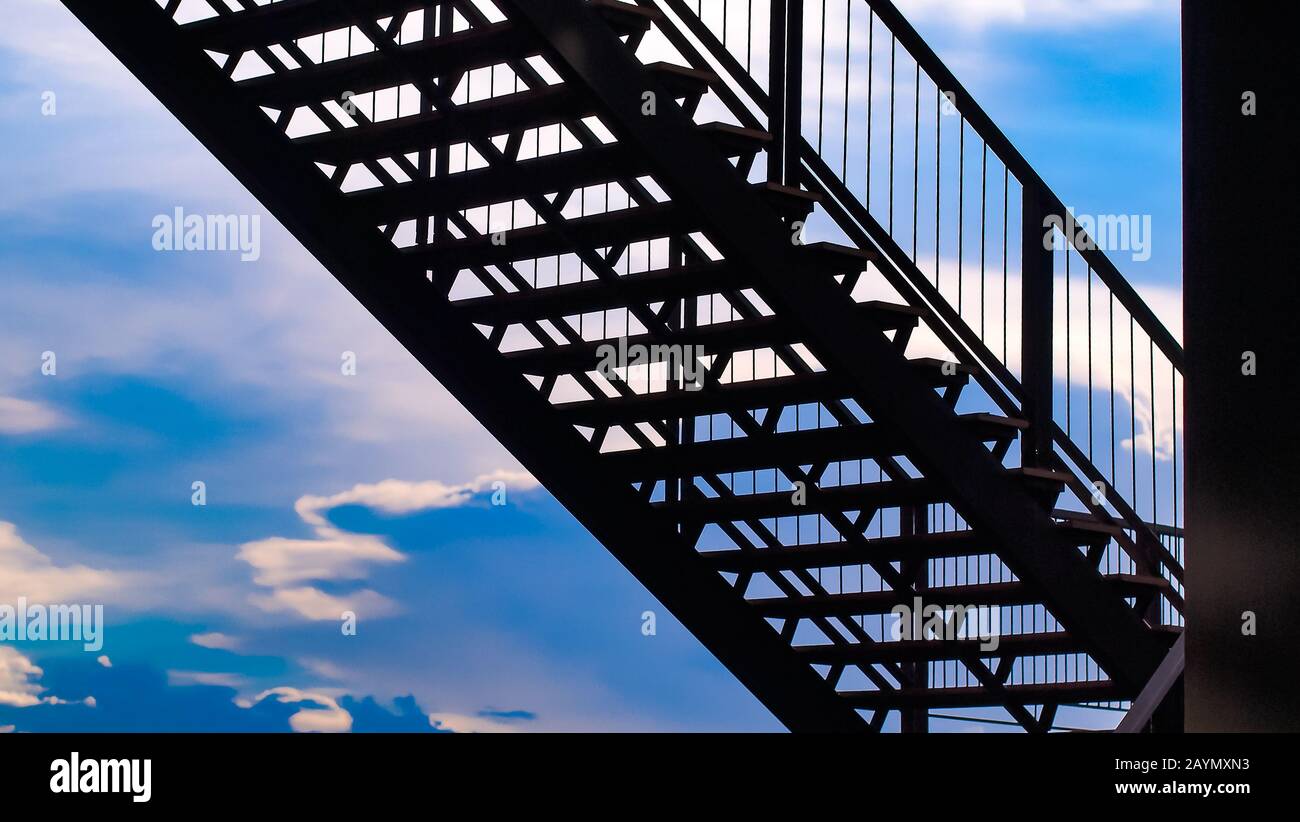 side view of outside metal staircase or fire exit stair with sheet ...