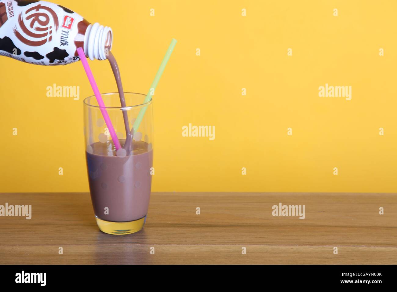 Pouring muller frijj milk into glass hi-res stock photography and ...
