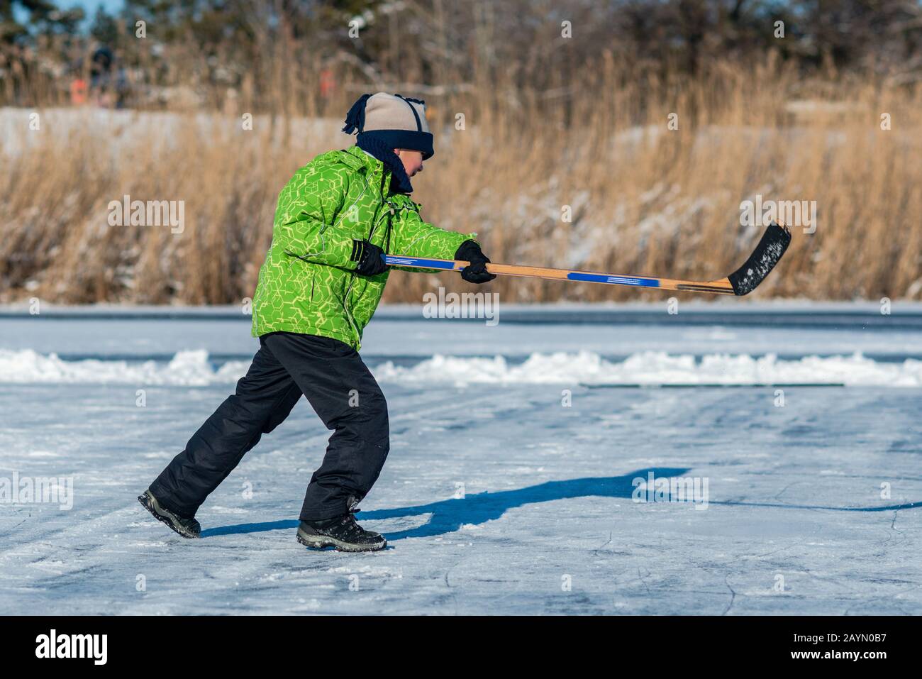Boy playing street hockey High Resolution Stock Photography and Images ...