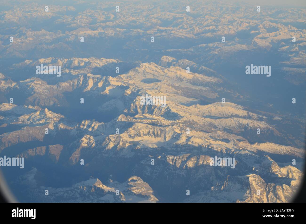 Mountain view from an airplane window Stock Photo - Alamy