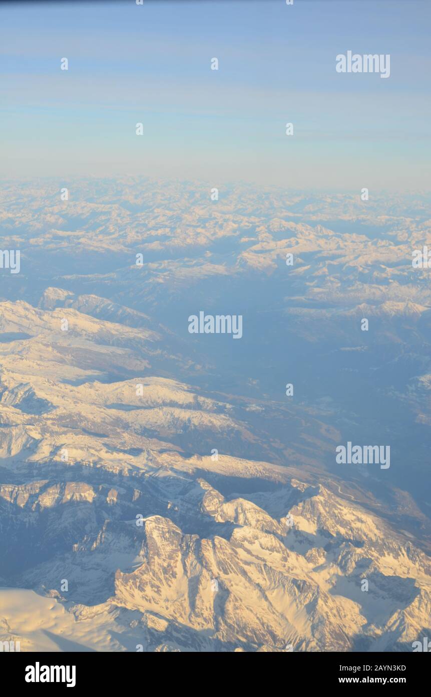 Mountain view from an airplane window Stock Photo - Alamy