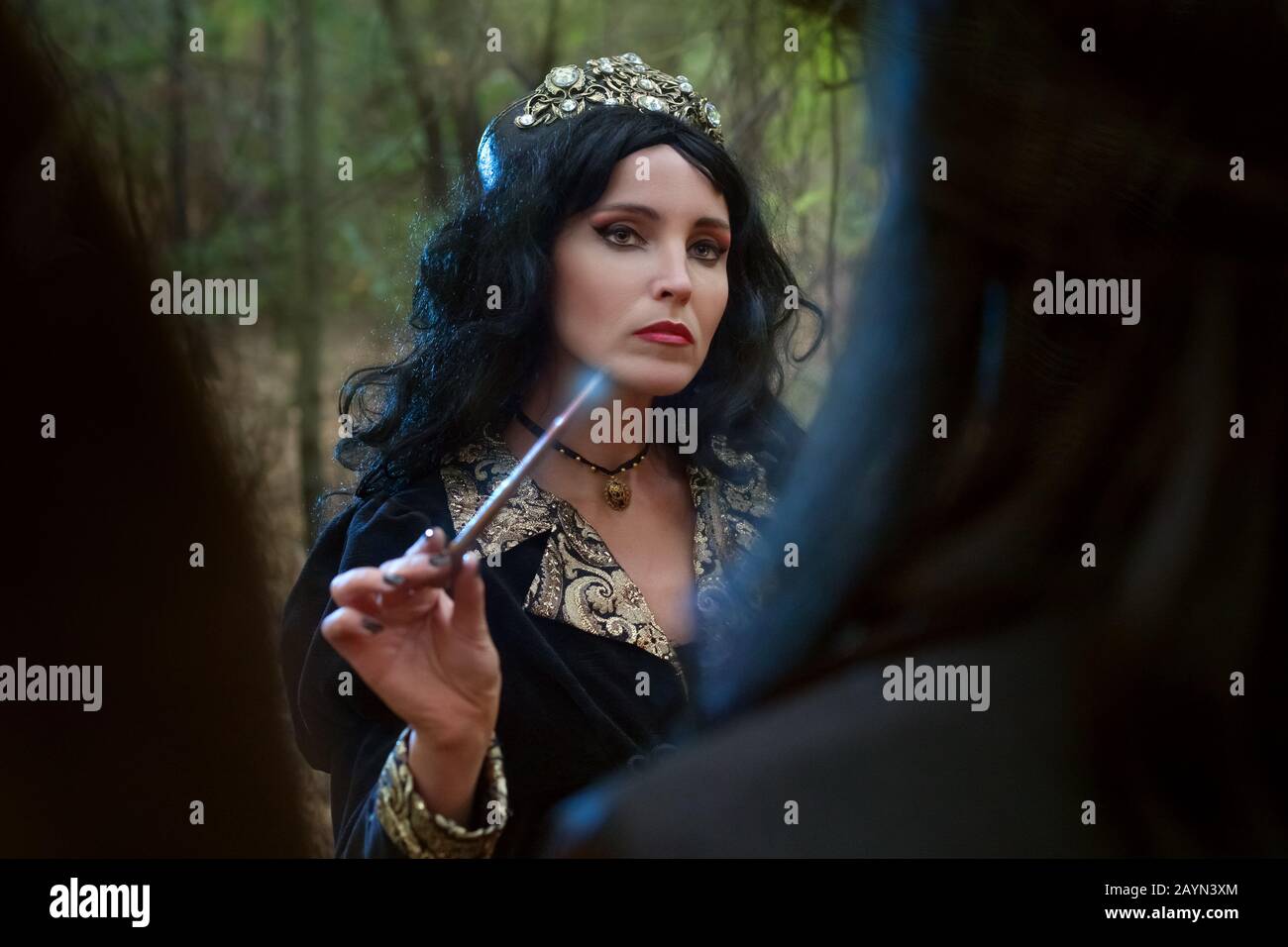 Portrait of a beautiful witch woman. She conducts rituals of black ...