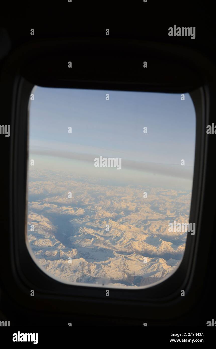 Mountain view from an airplane window Stock Photo - Alamy
