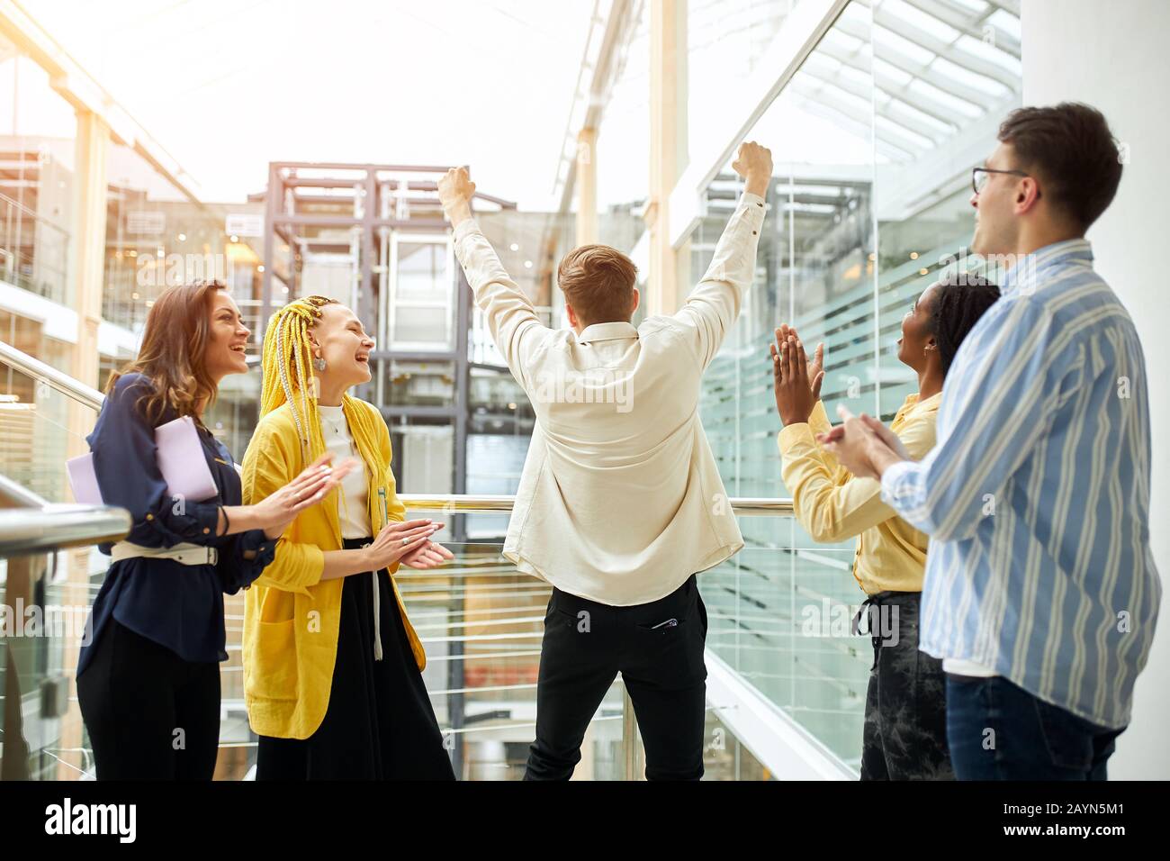 cheerful business people congratulating their colleague with birthday ...