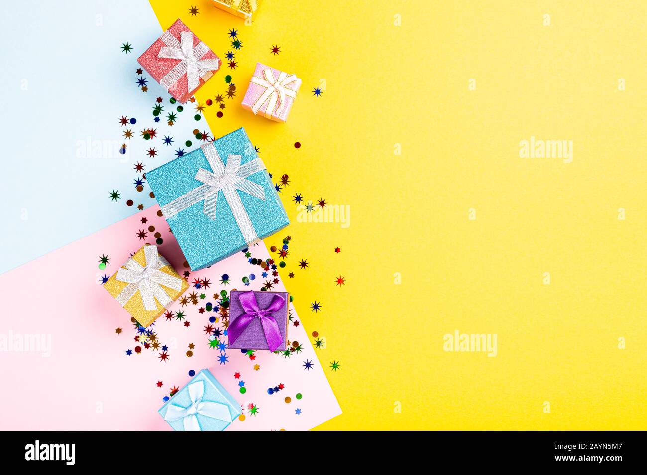 Festive background with colorful gift presents Stock Photo - Alamy