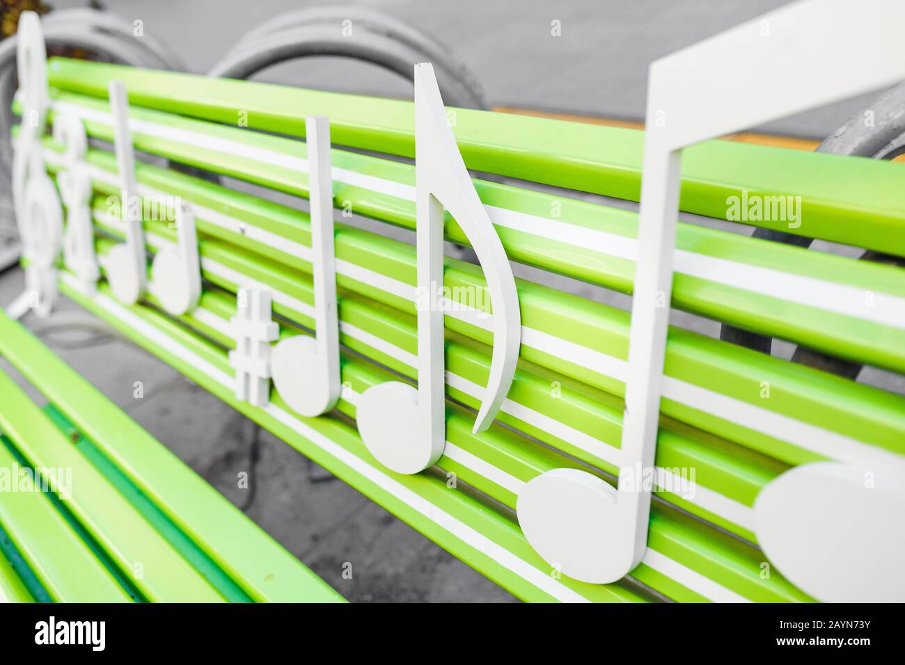 Musical notes on a bench as street decoration Stock Photo - Alamy