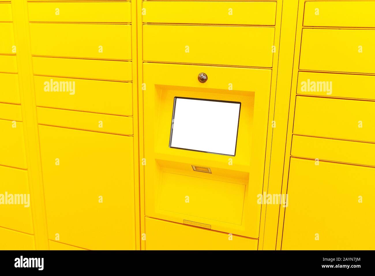 Yellow automated parcel post terminal with blank screen waiting for ...