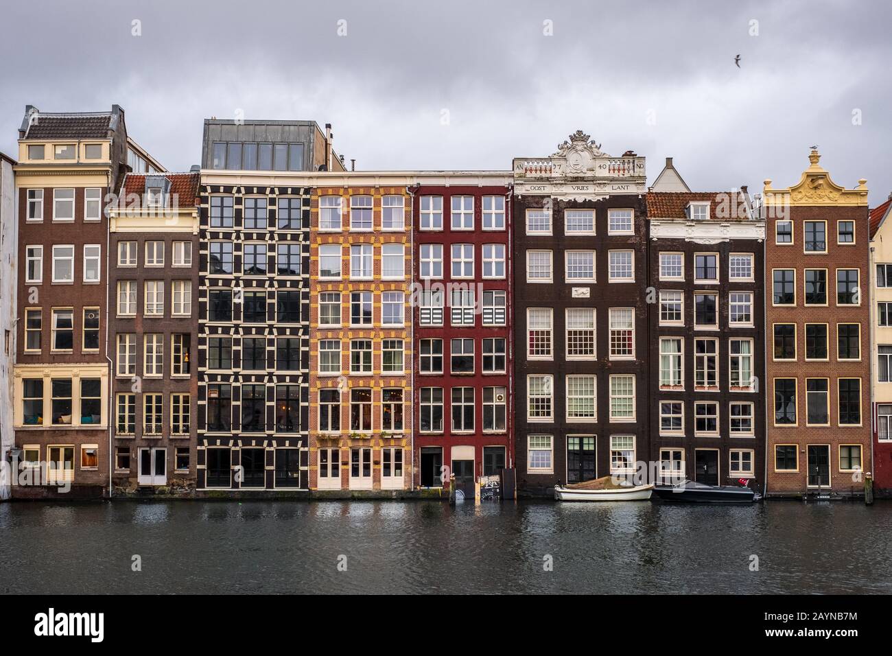 A colorful photo of traditional Dutch buildings on the river in ...