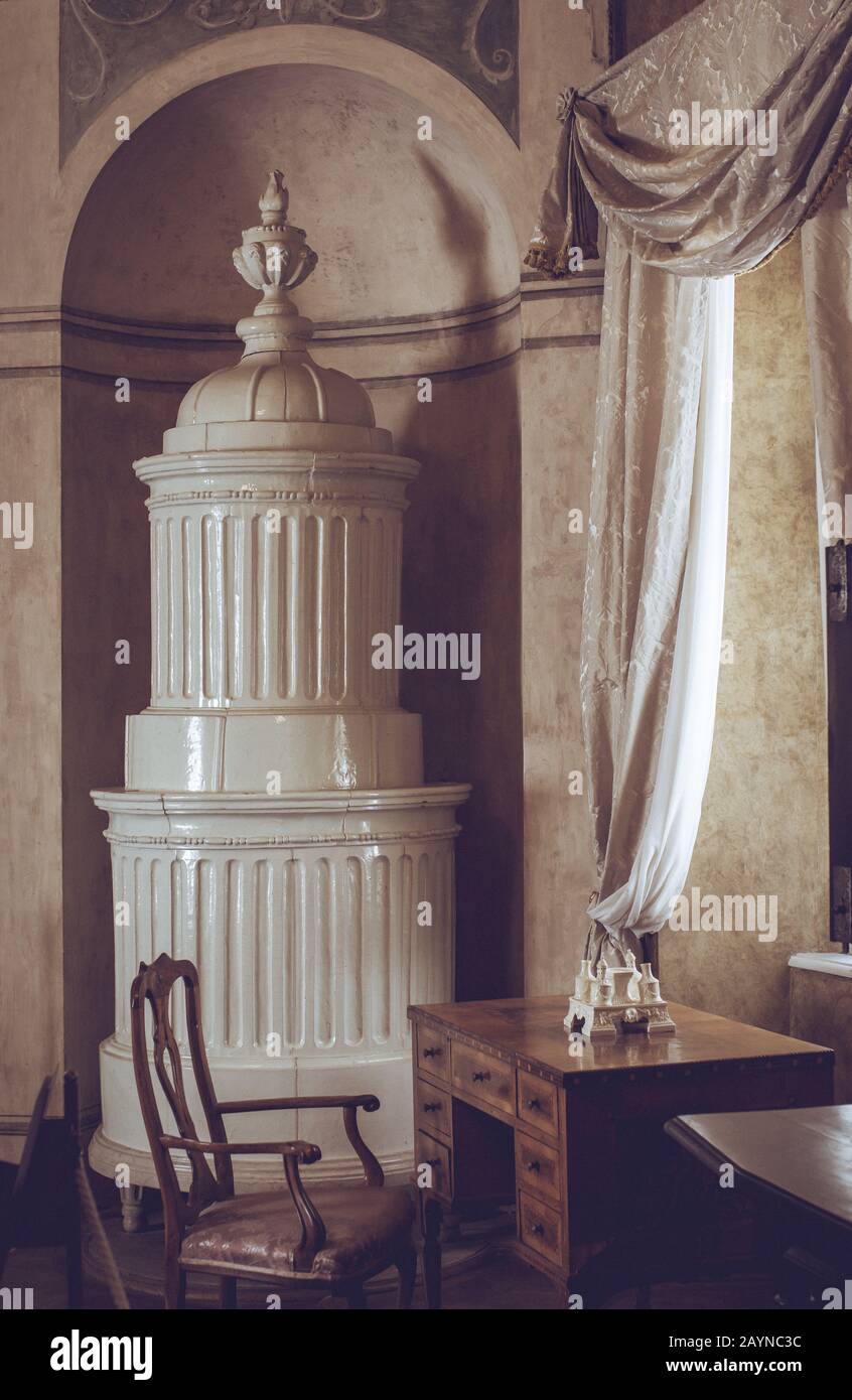 European old stove covered with ceramic majolica. ceramic wood burning ...