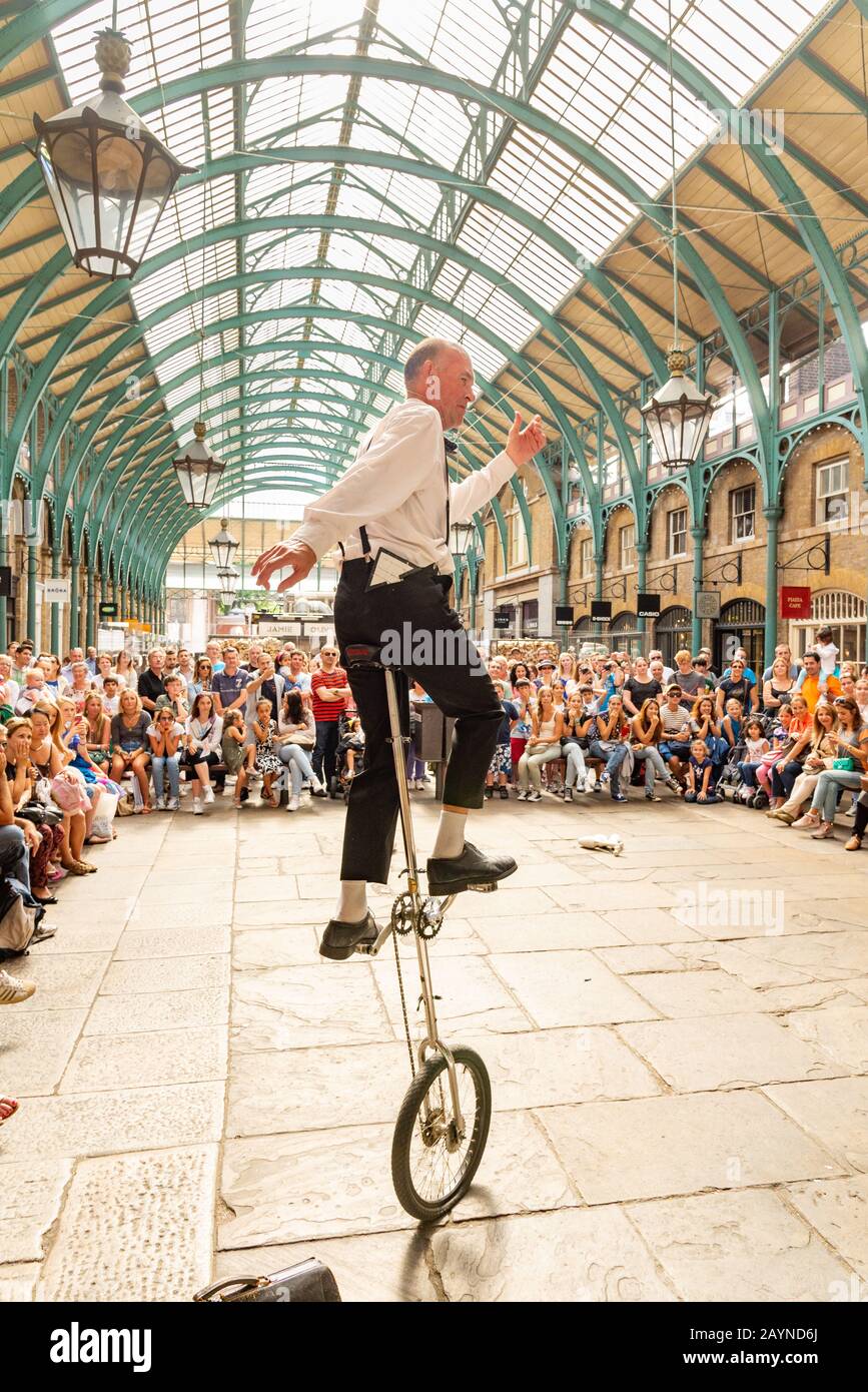 Man riding unicycle hi-res stock photography and images - Alamy