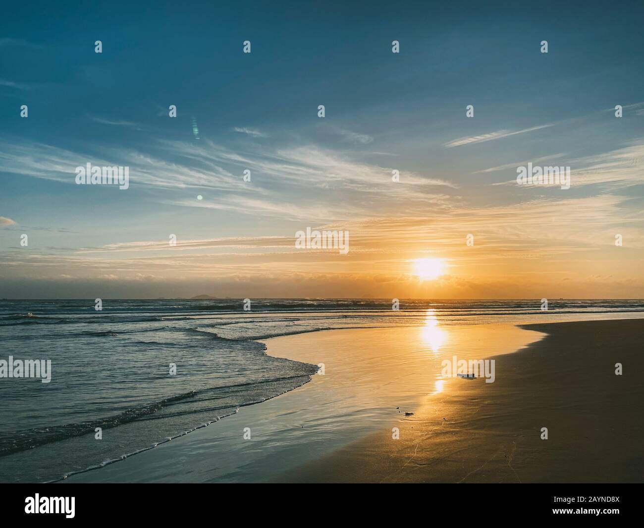 Beautiful sunrise, sunset of the sun through the clouds, the rays of ...