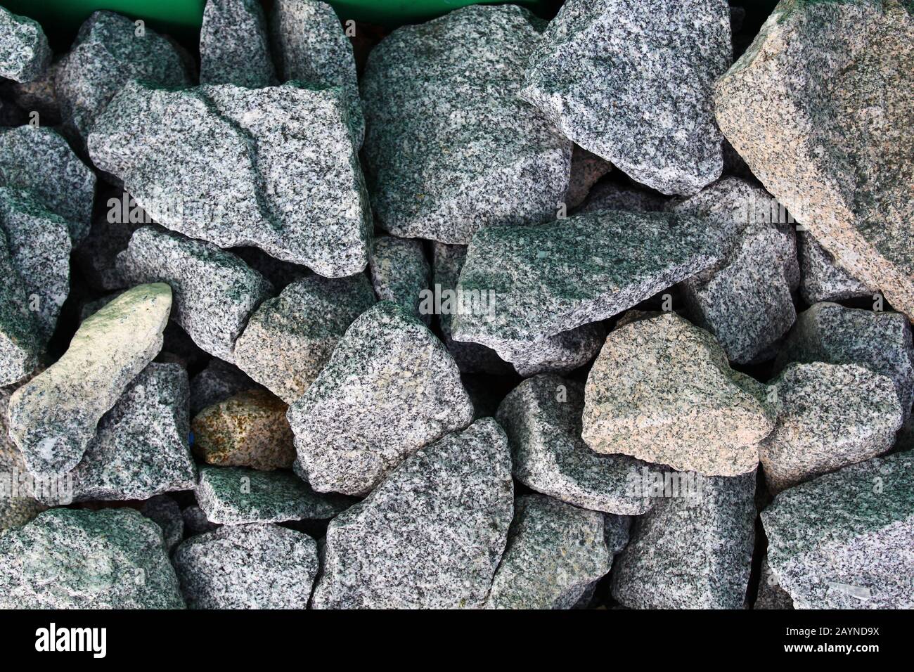 The picture shows a background with many grey stones Stock Photo - Alamy