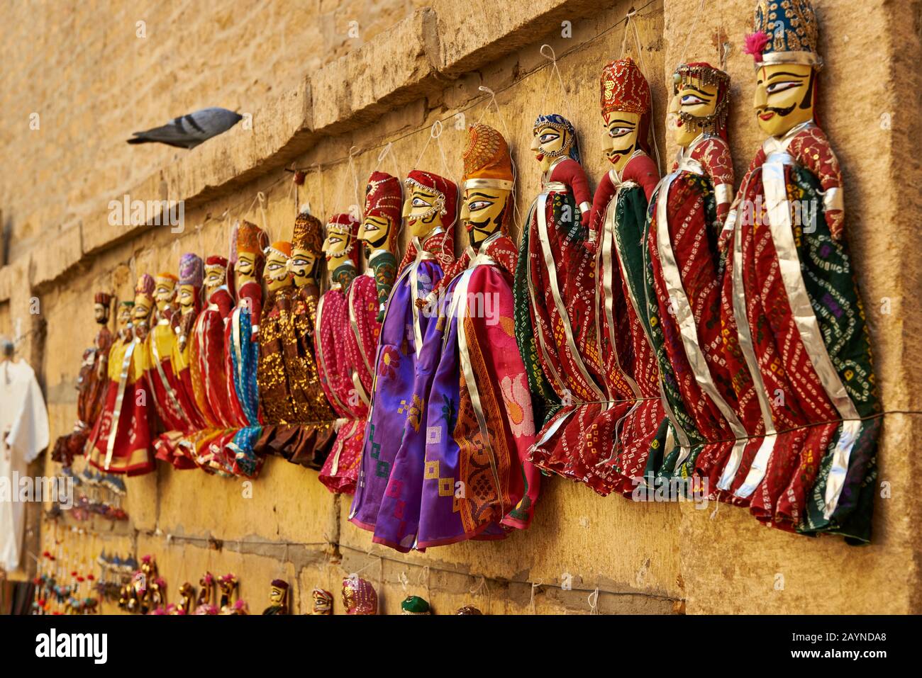 puppets hanging on a wall in Jaisalmer, Rajasthan, India Stock Photo ...
