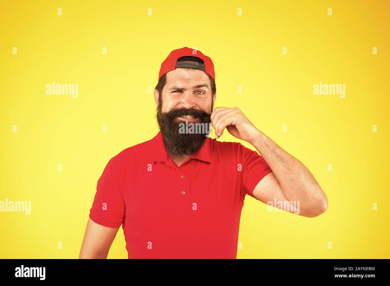 Feeling awesome. Man bearded hipster twisting mustache yellow ...