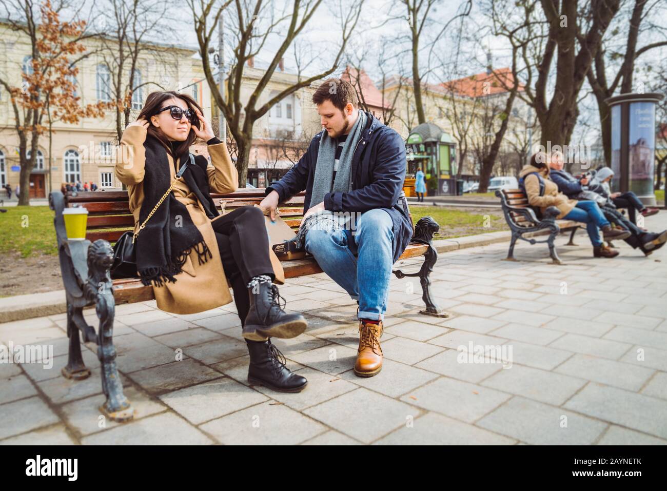 Woman eating burger bench hi-res stock photography and images - Alamy