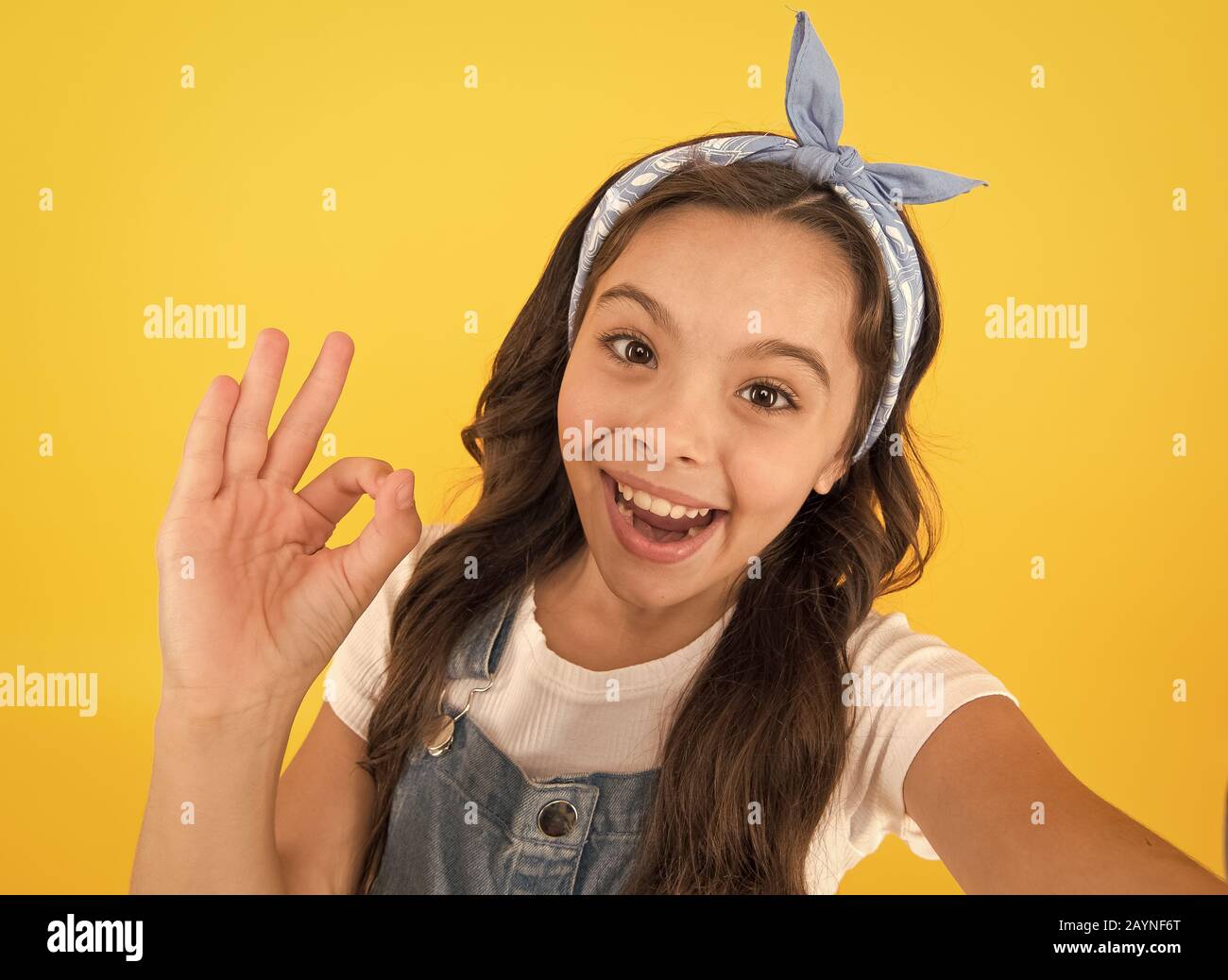 Its ok. Happy little child with ok hand on yellow background. Small ...