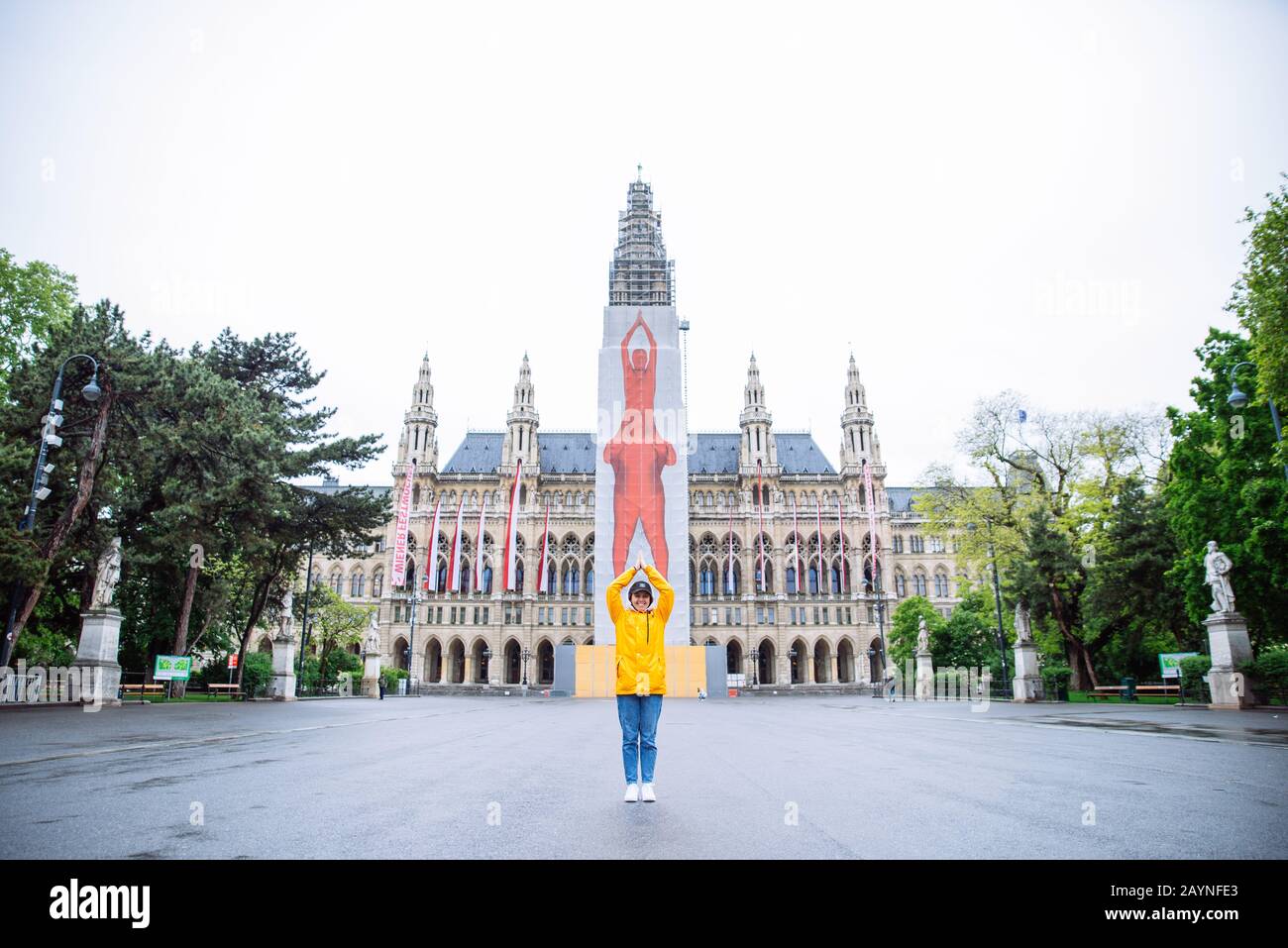 Vienna, Austria - May 16, 2019: female woman tourist in yellow raincoat ...