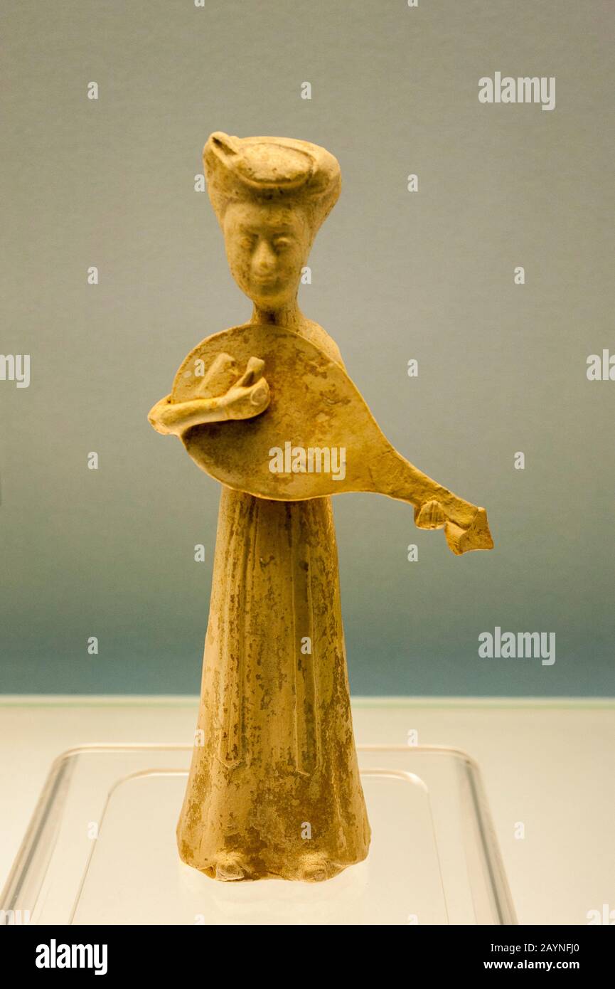 Woman playing a pipa statue from 580 AD in an exhibit at the Shanghai ...
