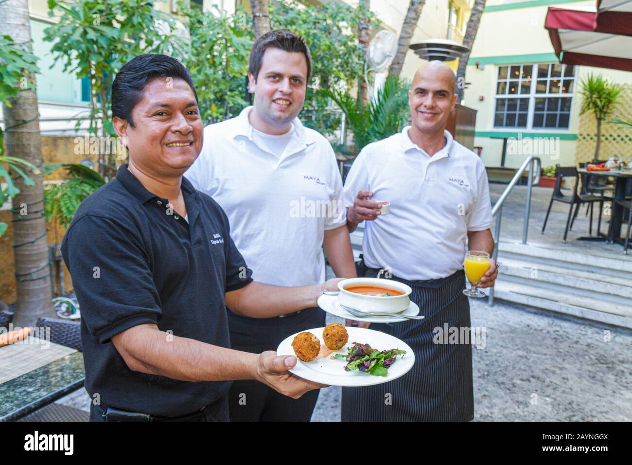 Staff employees workers waiter servers hi-res stock photography and ...