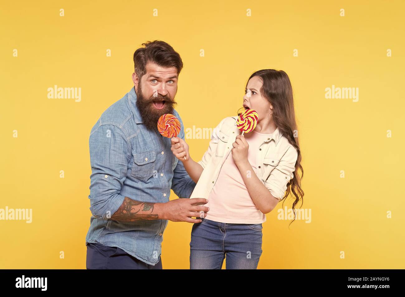 Sharing sweets with dearest people. Daughter and father eat sweet ...