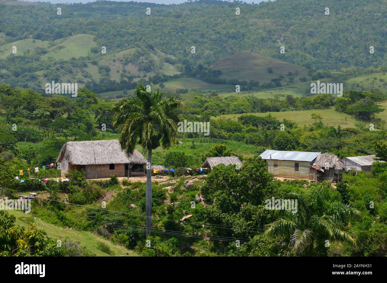 Traditional rural dwellings near the village of Guisa, at the foothills ...