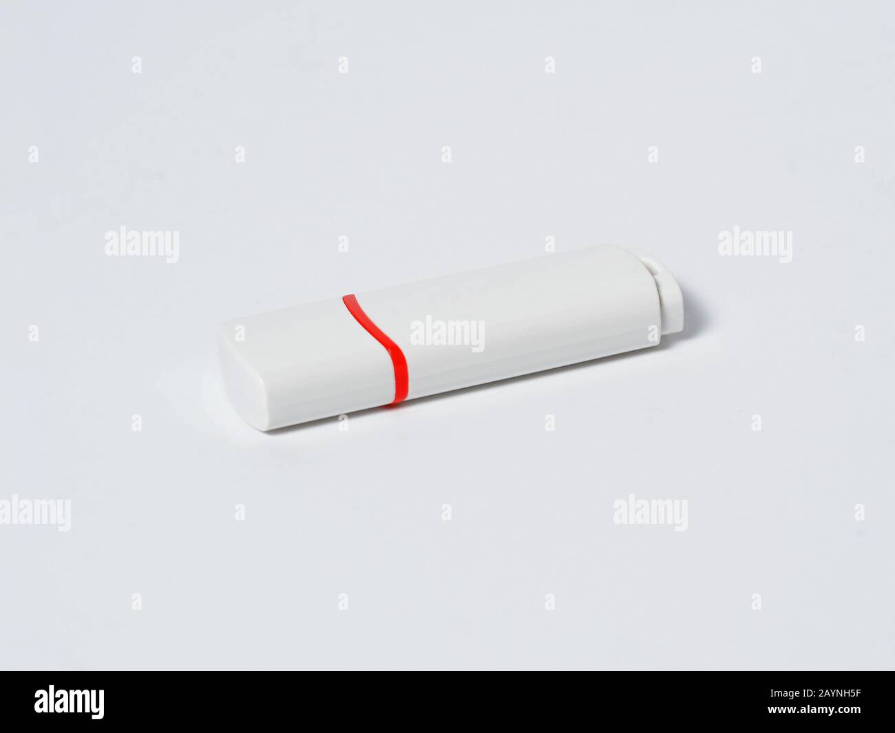 White usb flash drive isolated with a red stripe on the white ...