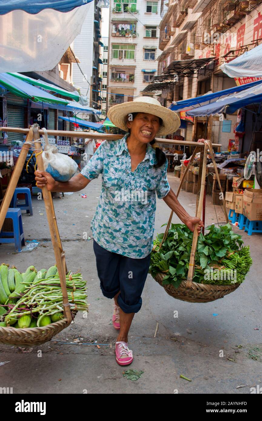 Shoulder carrying pole china hi-res stock photography and images - Alamy