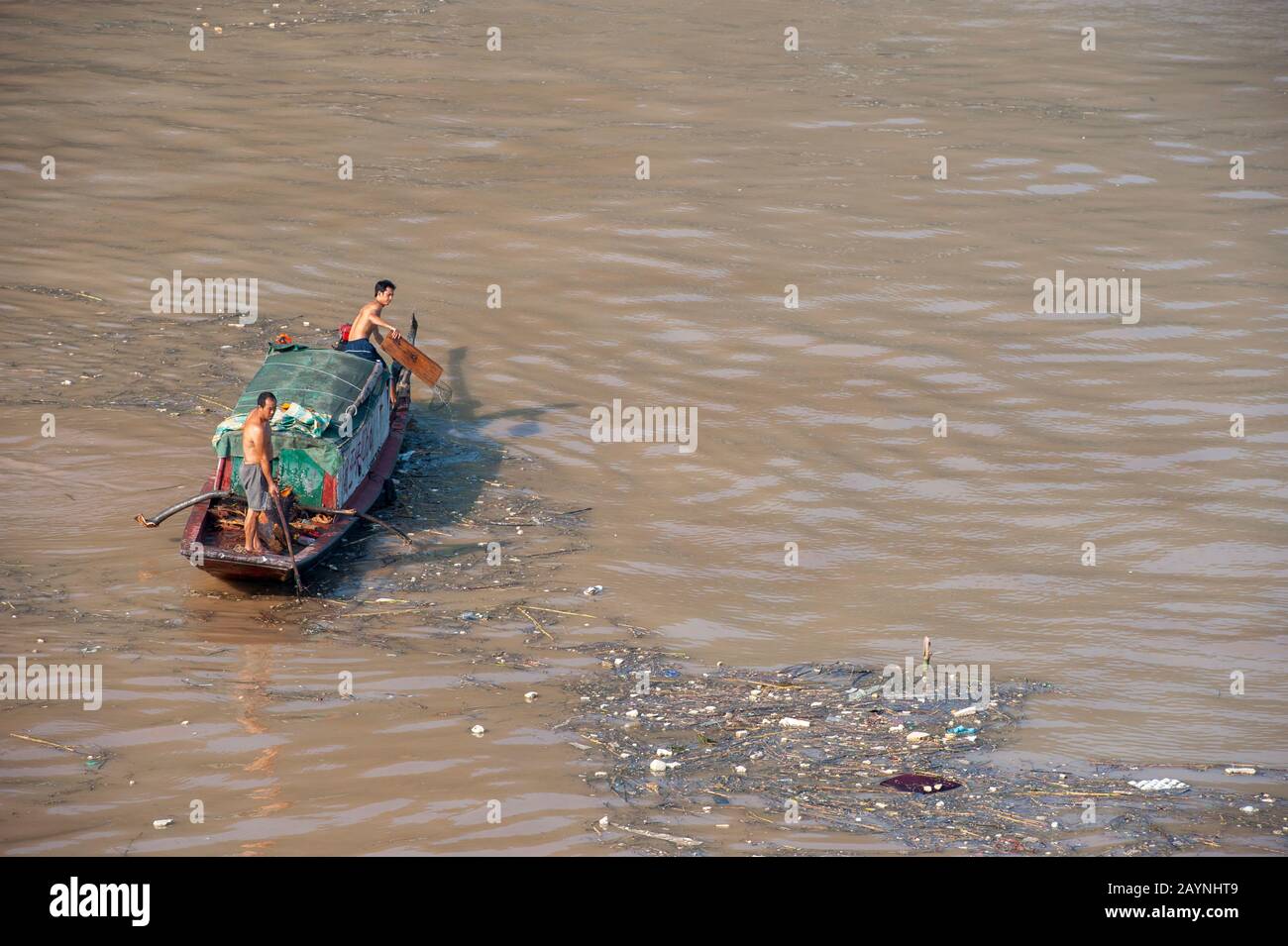A boat is collecting floating garbage at the Wu Gorge (Three Gorges) on ...
