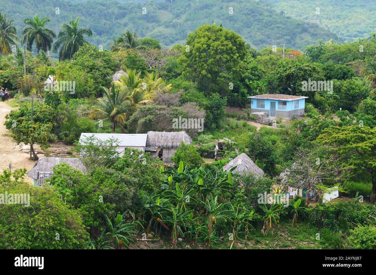 Traditional rural dwellings near the village of Guisa, at the foothills ...