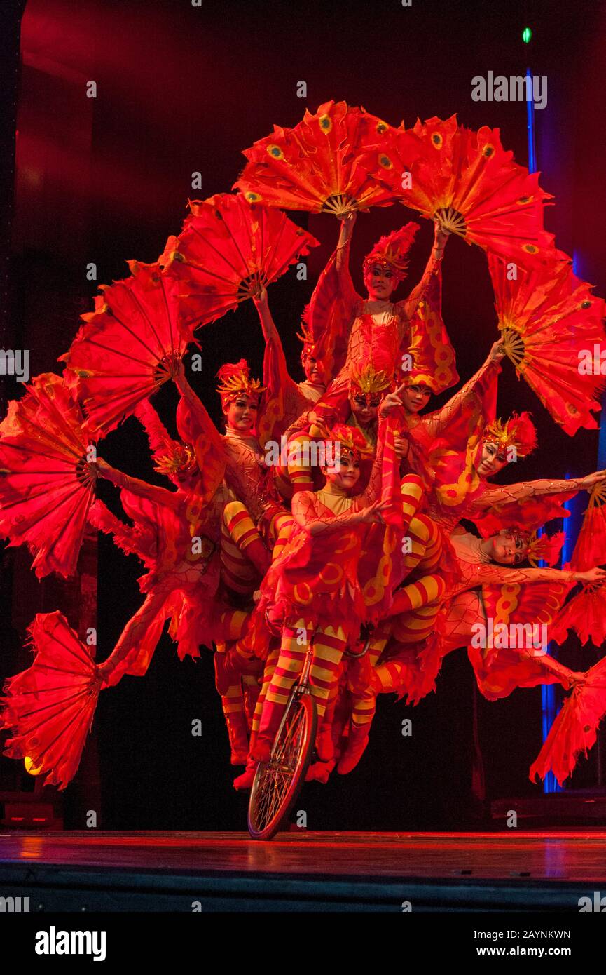 Action packed and colorful acrobatic show with women on a bicycle in ...