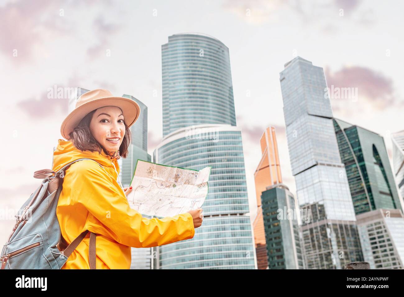 Happy asian Woman travel in central district of a modern city center ...