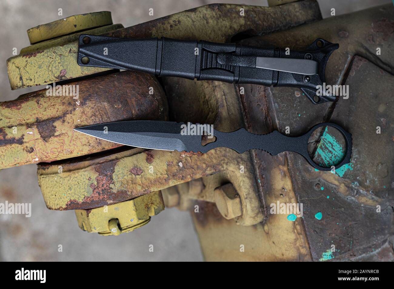 Top view on a military knife and case. Flat lay Stock Photo - Alamy