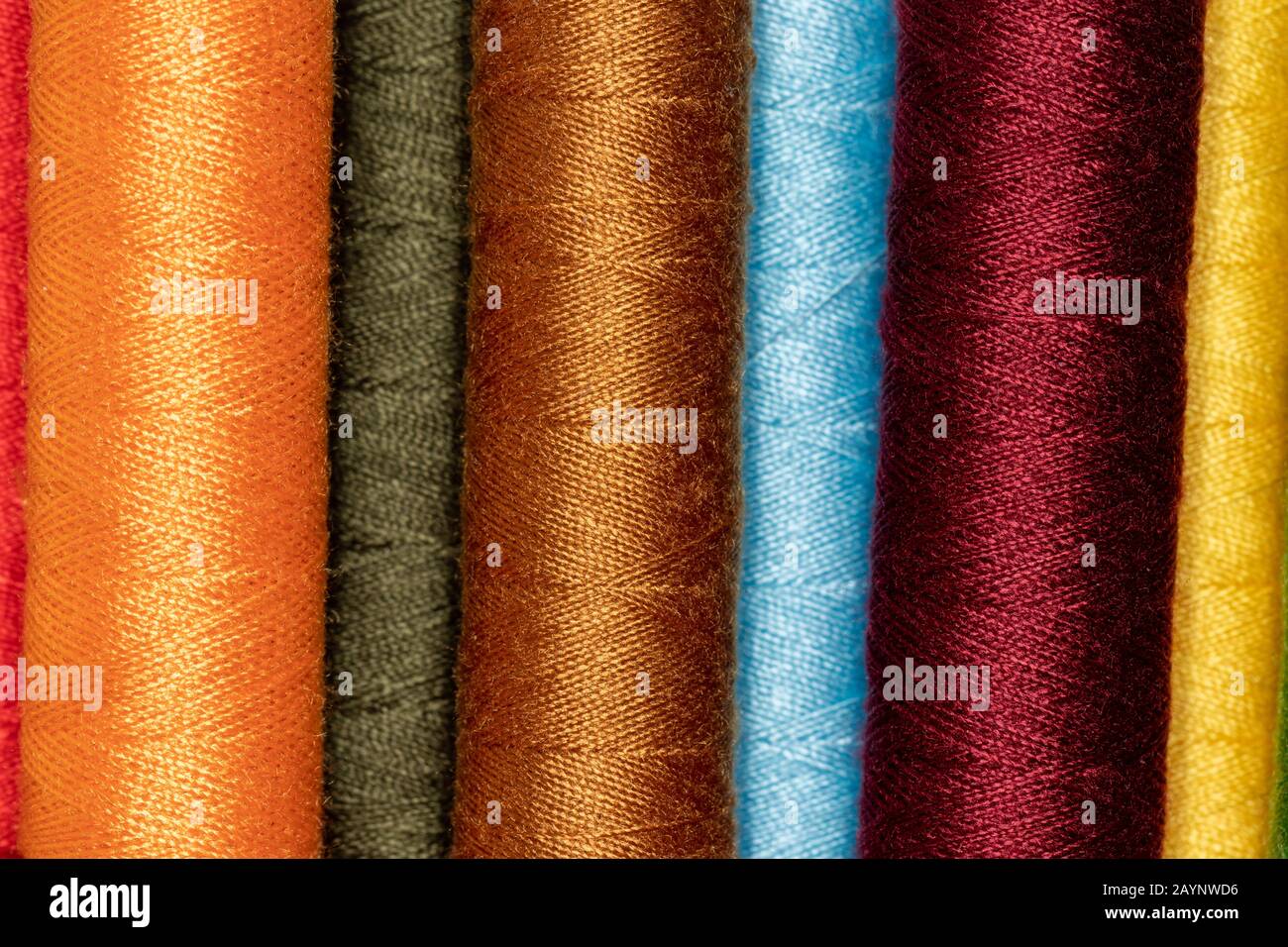 Vertical cones with colored sewing thread Stock Photo - Alamy